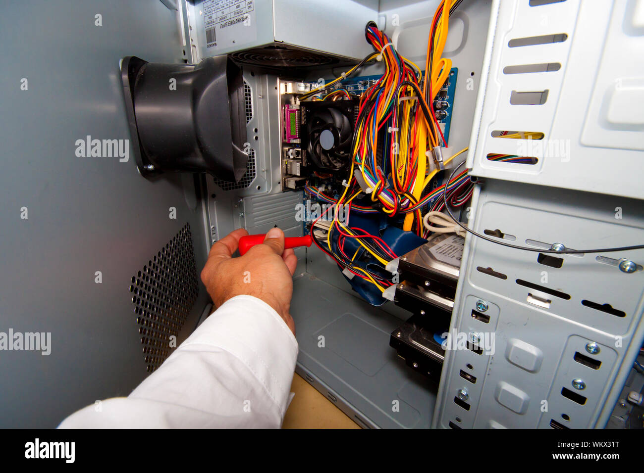 Inside of the personal computer (power suplay motherboard, cables ...