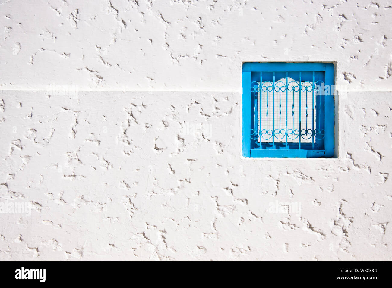 Typical mediterranean small, square, vintage blue window Stock Photo ...