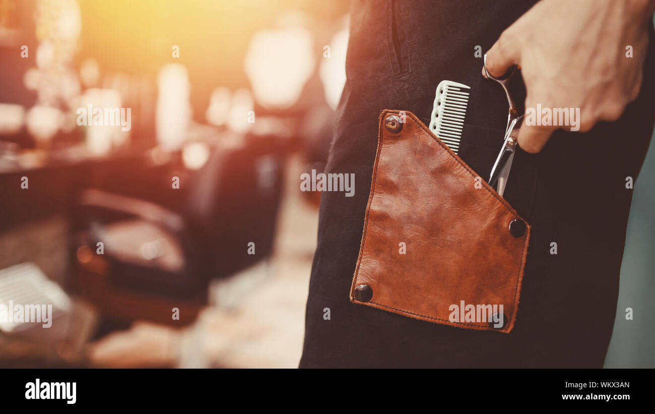 Barber holding scissors comb hi-res stock photography and images - Alamy
