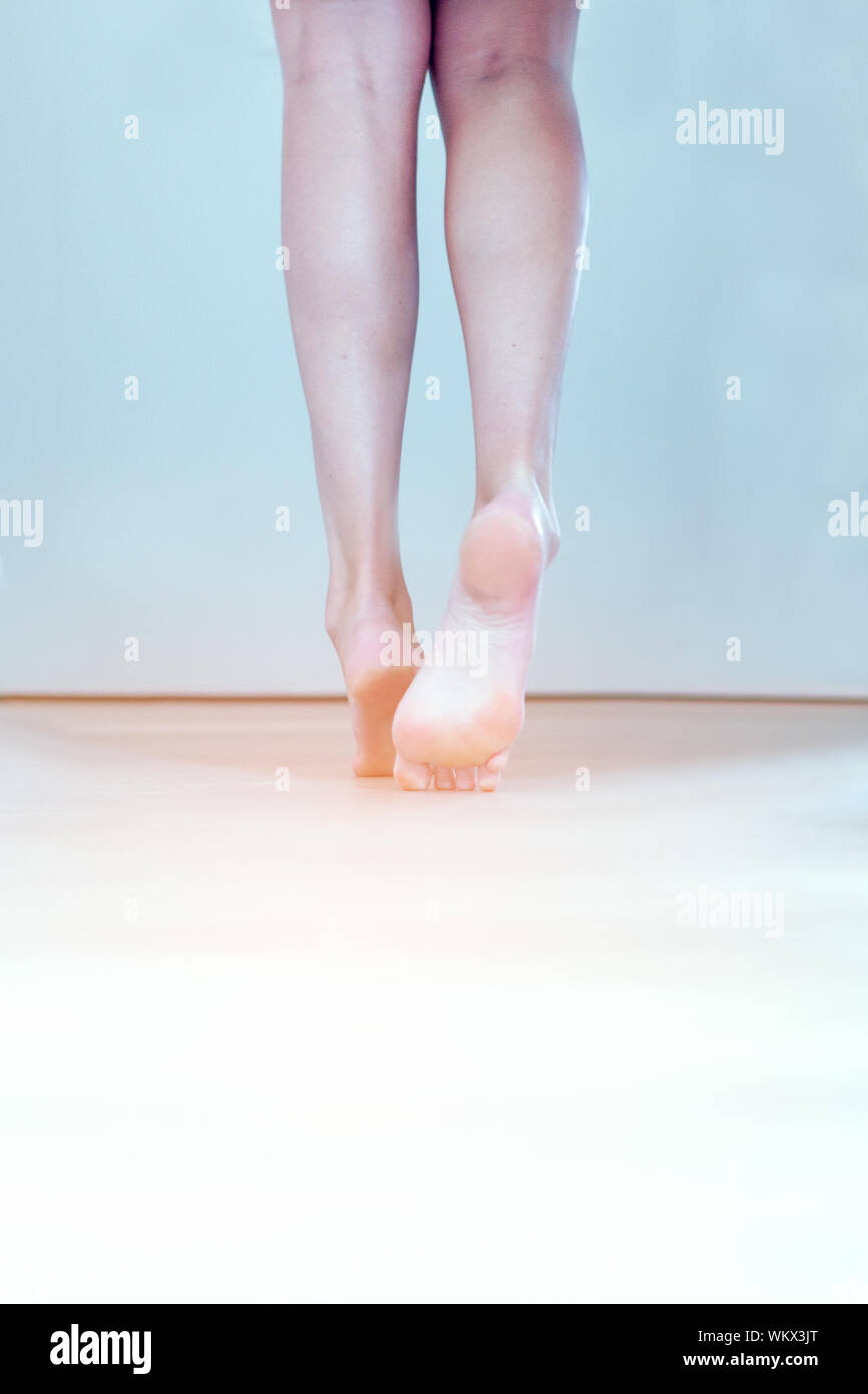 Woman tiptoeing hi-res stock photography and images - Alamy