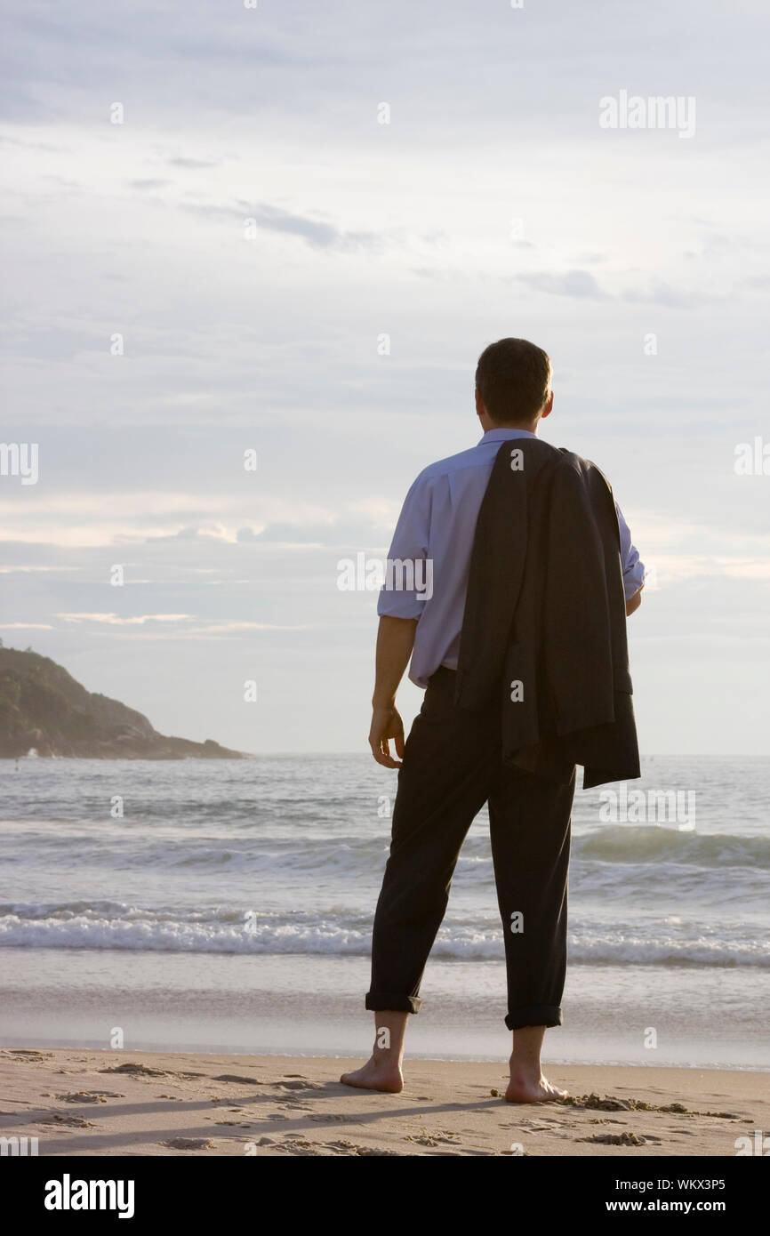 Businessman relaxing barefoot on beach hi-res stock photography and ...
