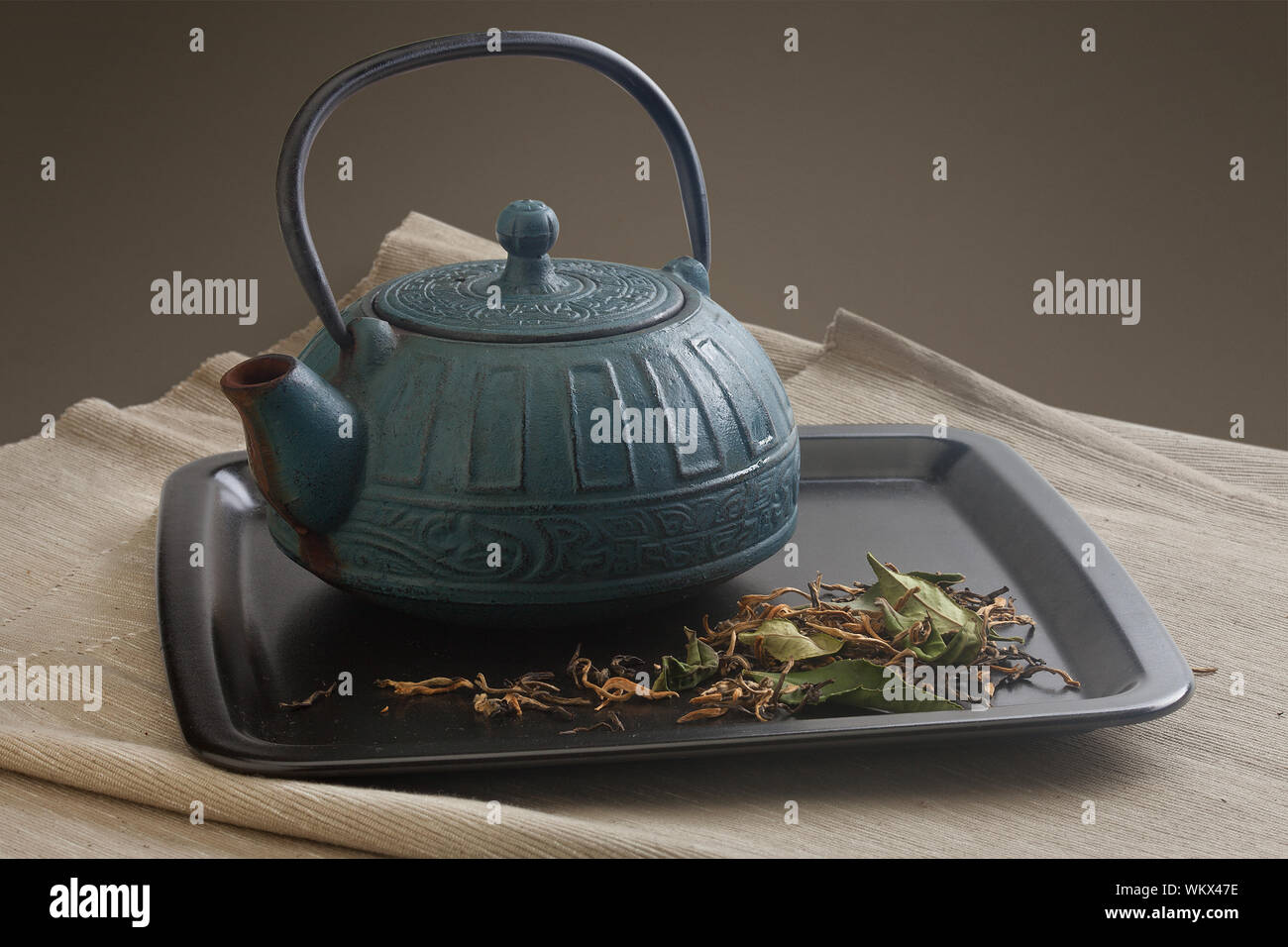 Green tea leaves and teapot hi-res stock photography and images - Alamy