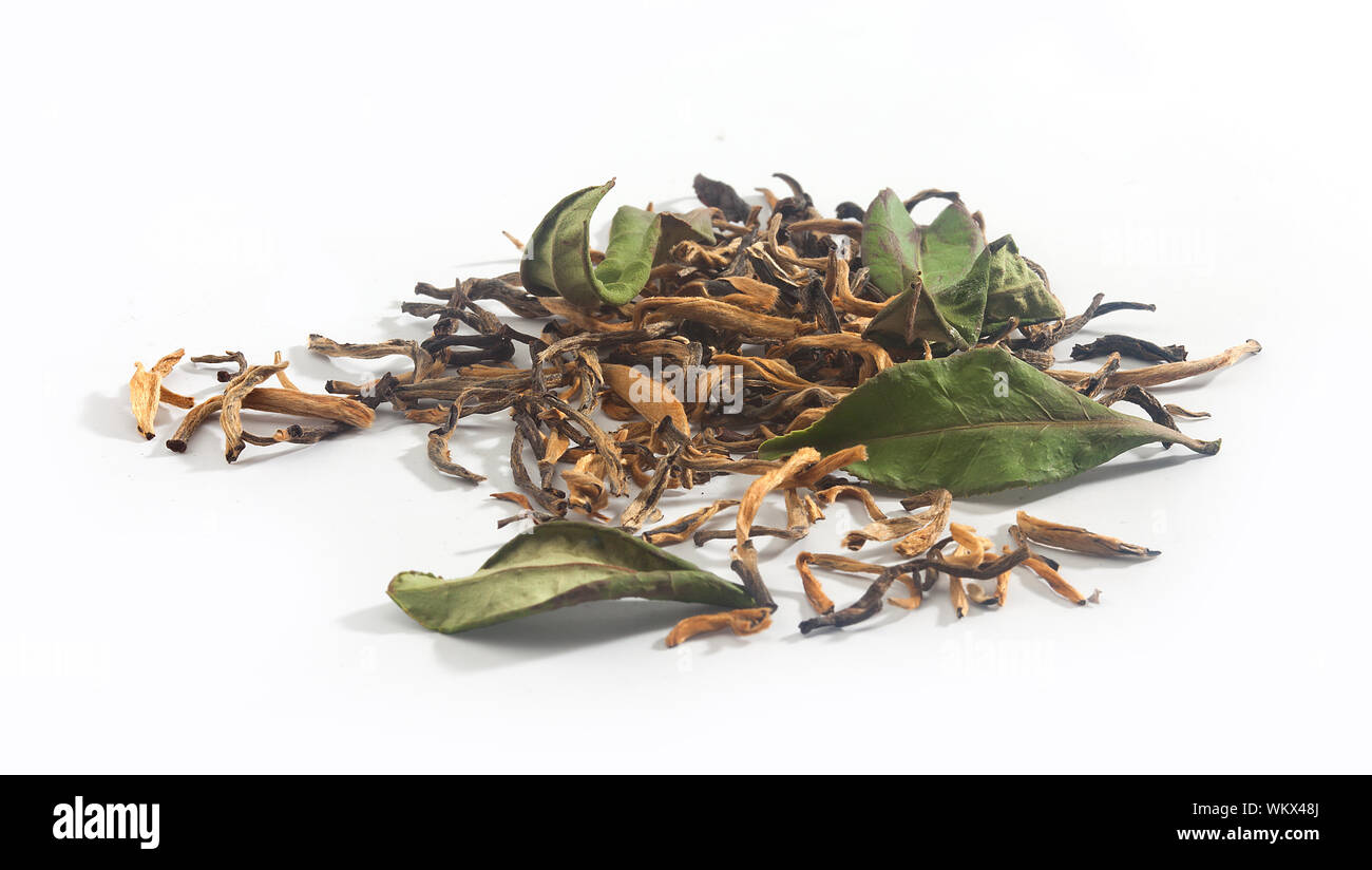 Dried green and yellow tea leaves on the white background Stock Photo ...