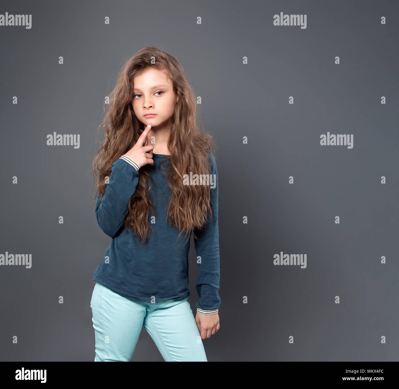 Thinking pupil kid girl thinking and have an idea with finger under the ...