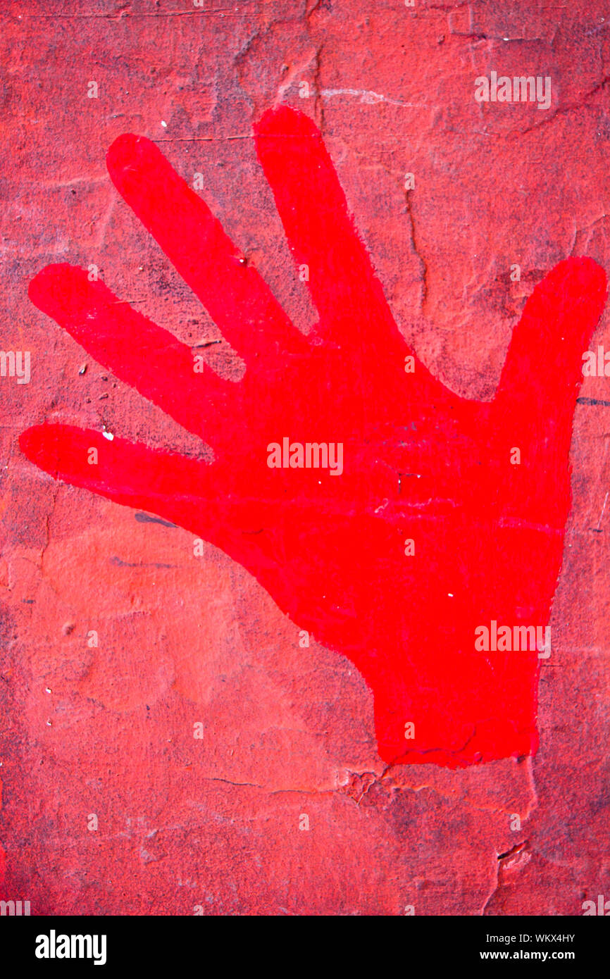 Red hand print on the red wall Stock Photo - Alamy