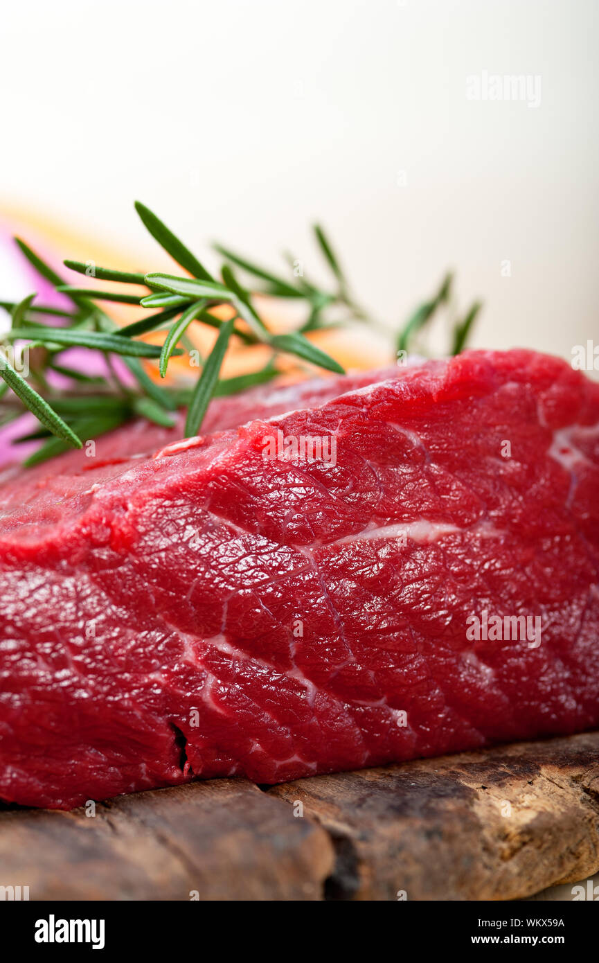 fresh raw beef cut ready to cook with vegetables and herbs Stock Photo ...