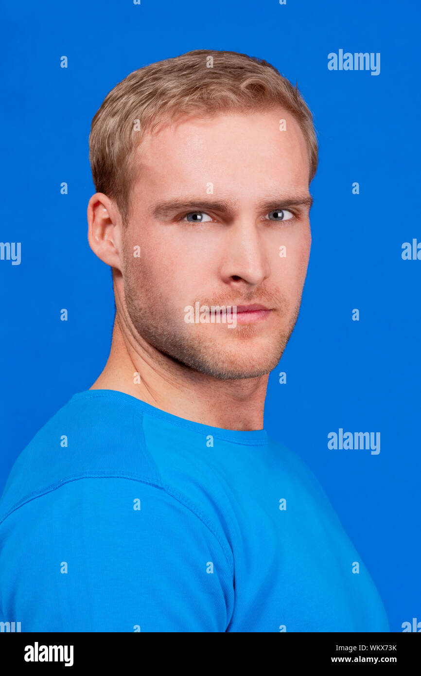 Handsome young man blond hair and blue eyes hi-res stock photography ...