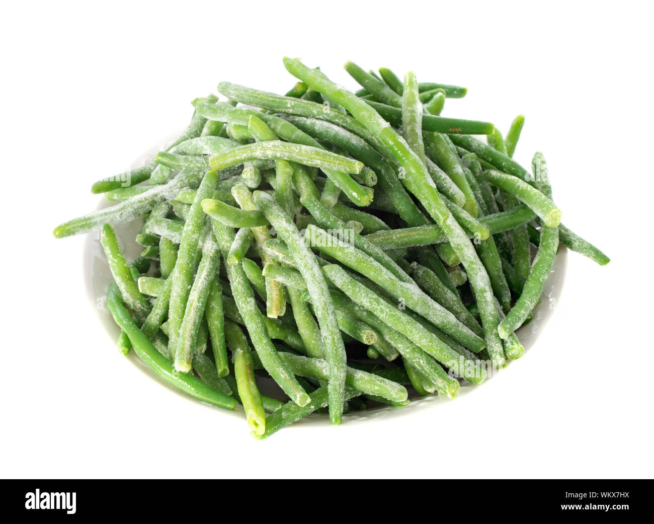 frozen green bean in front of white background Stock Photo - Alamy