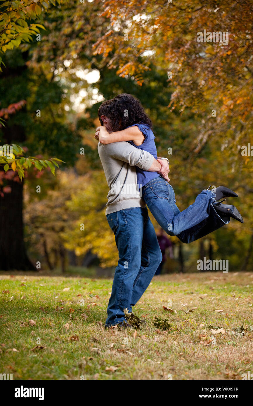 A man giving a woman a big hug - lifting her off the ground Stock Photo ...