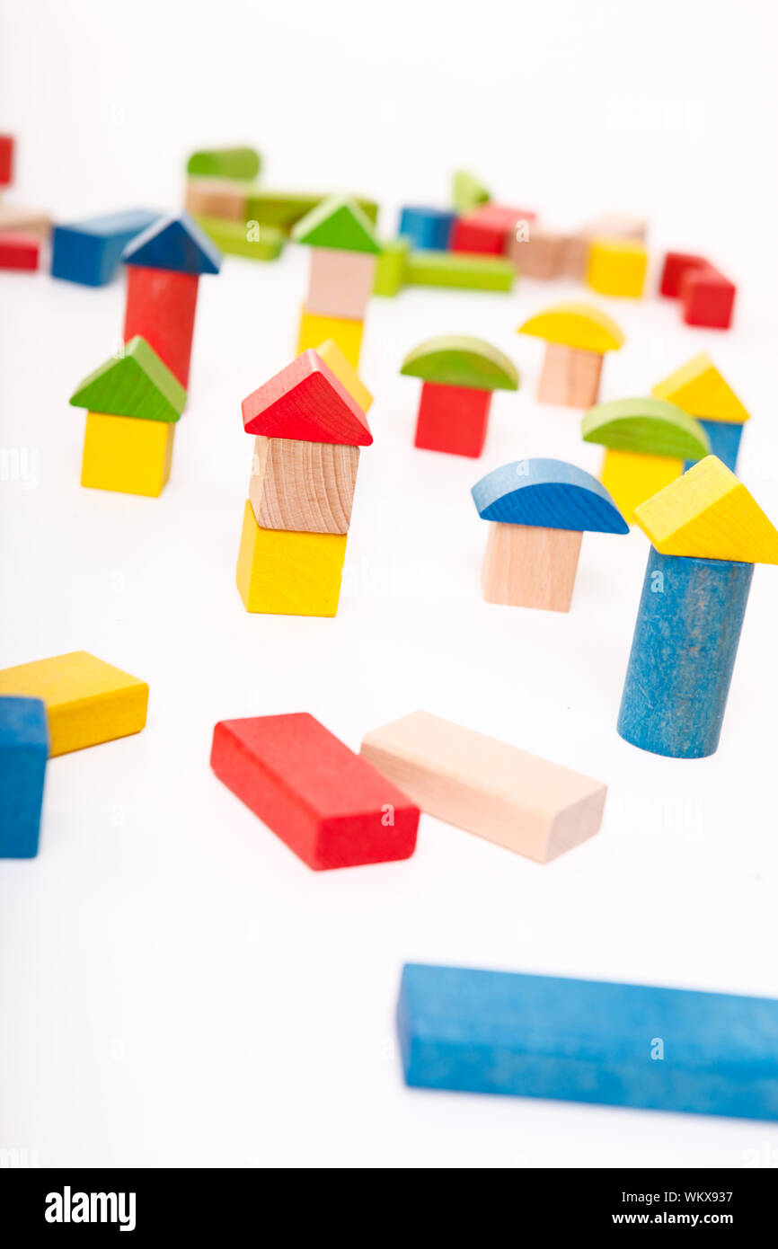 Colorful town build from wooden blocks isolated on white background ...