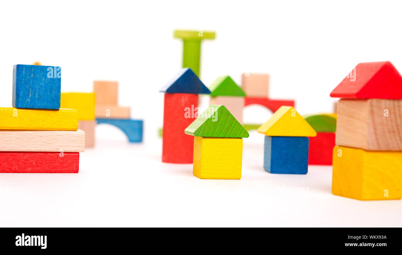 Colorful town build from wooden blocks isolated on white background ...
