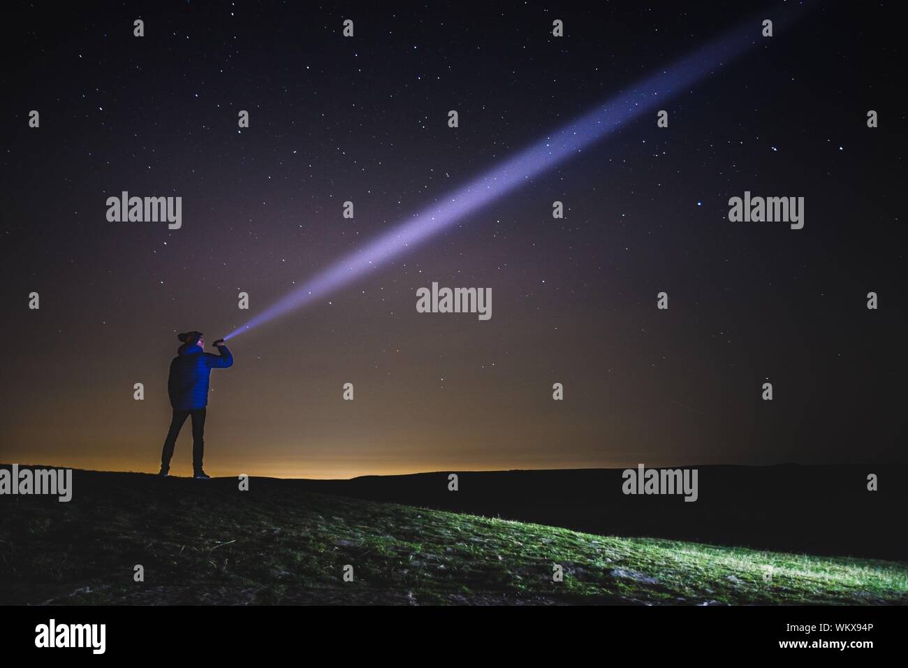 Person in field pointing hi-res stock photography and images - Alamy