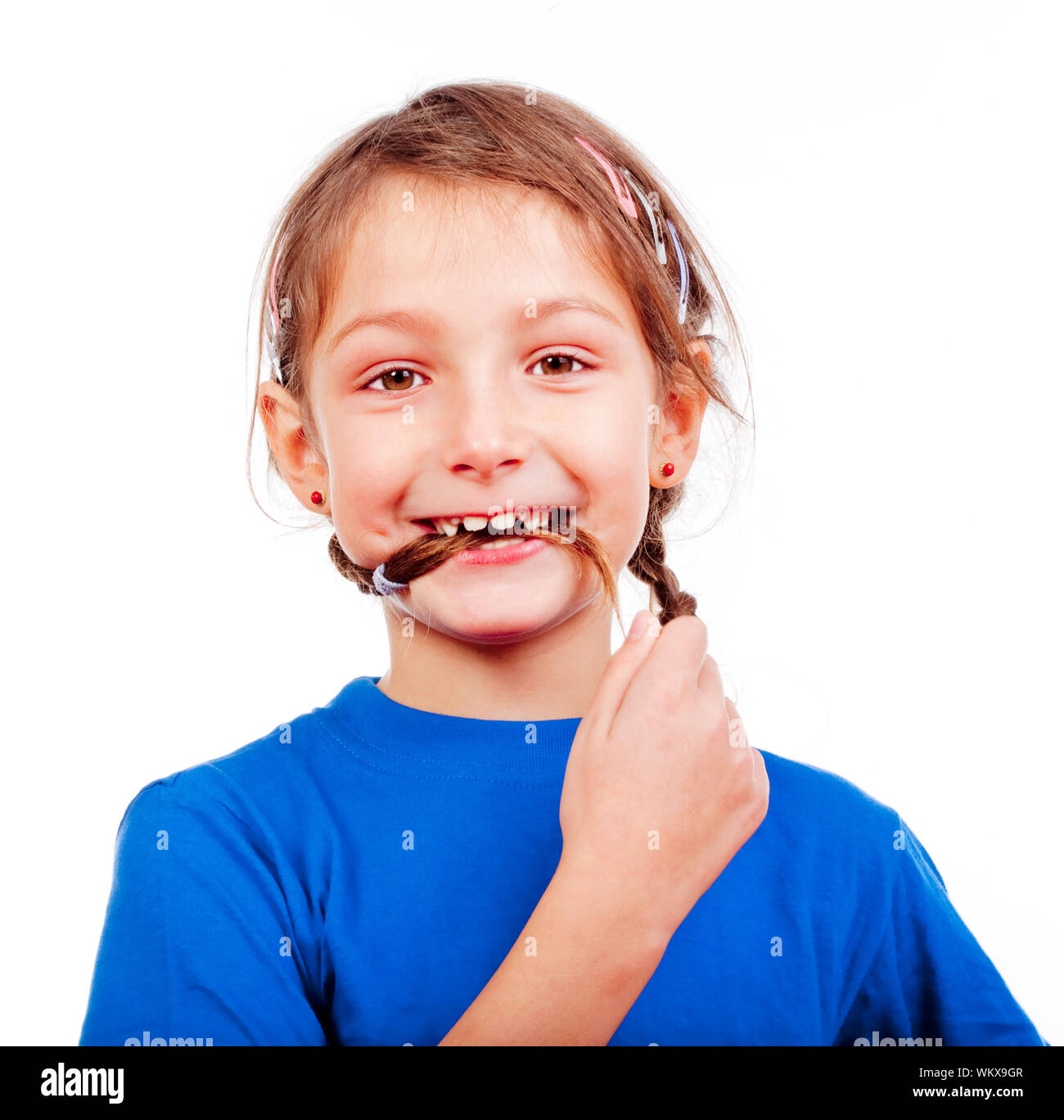 portrait of a little girl biting her braid - isolated on white Stock ...