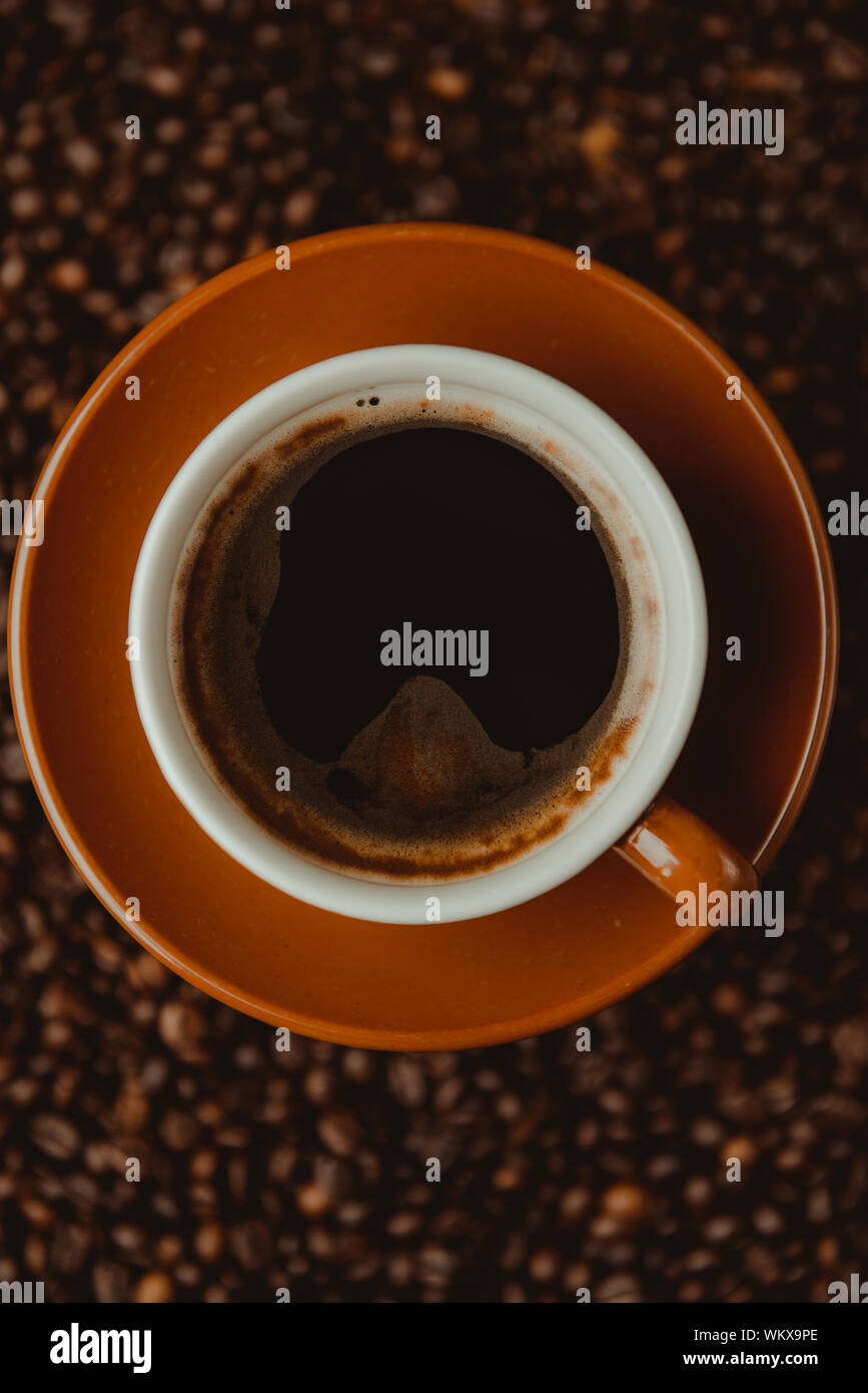Coffee cup and beans on a background Stock Photo - Alamy