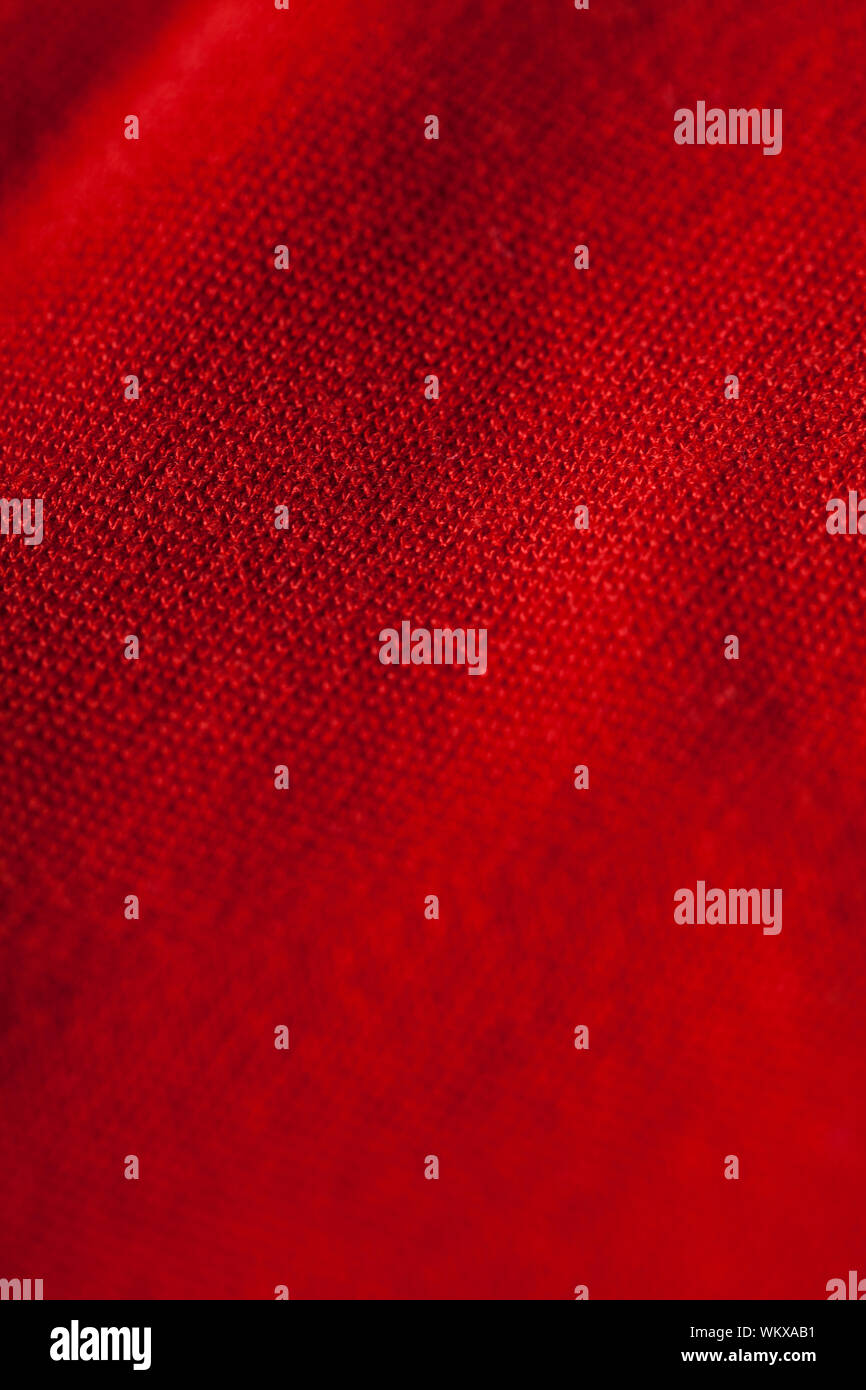 Abstract background texture of luxurious red fabric arranged in sensual ...