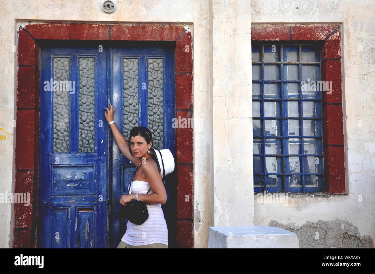 Portrait mature woman standing door hi-res stock photography and images ...