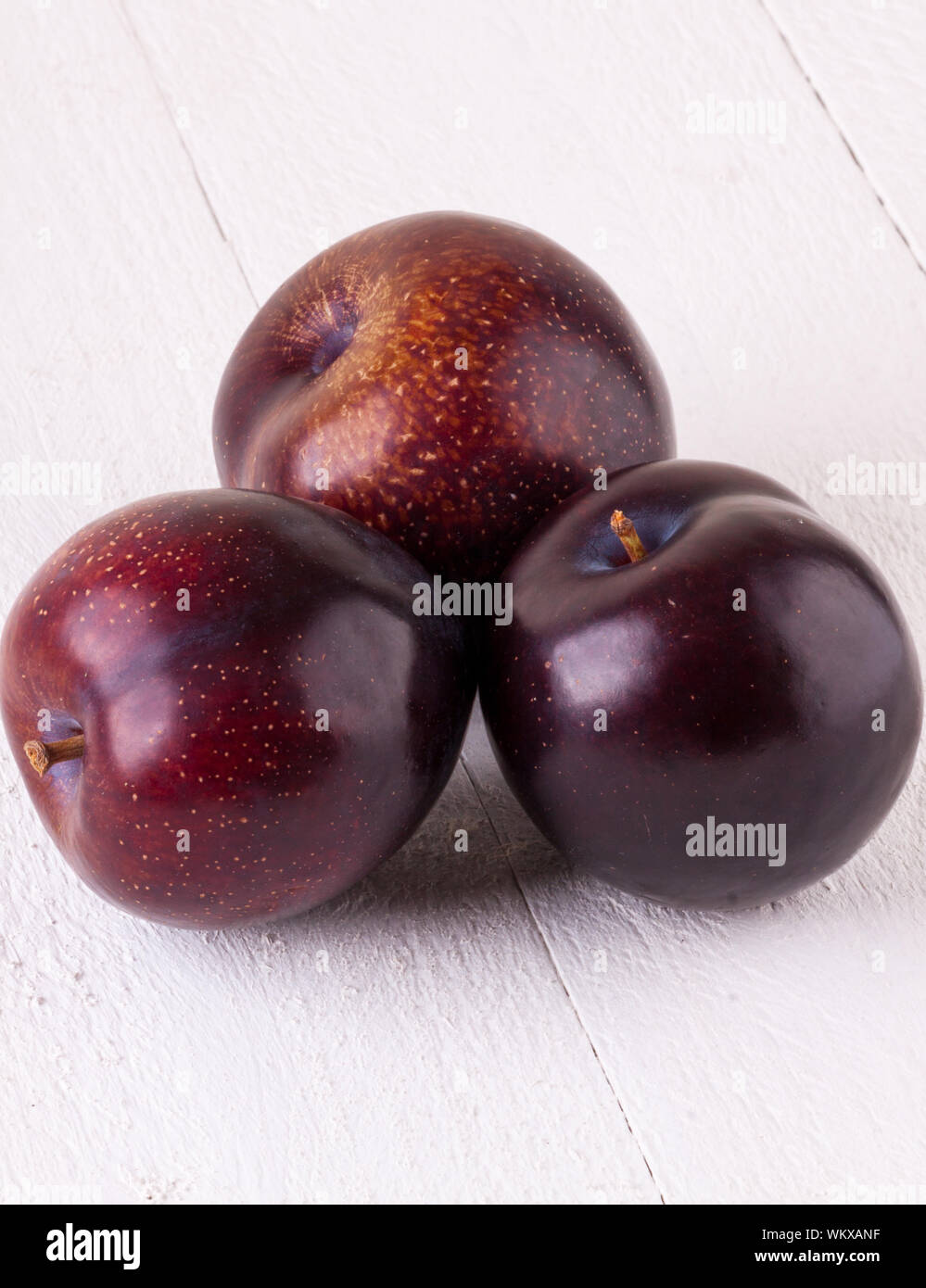 Fresh ripe red plums Stock Photo - Alamy