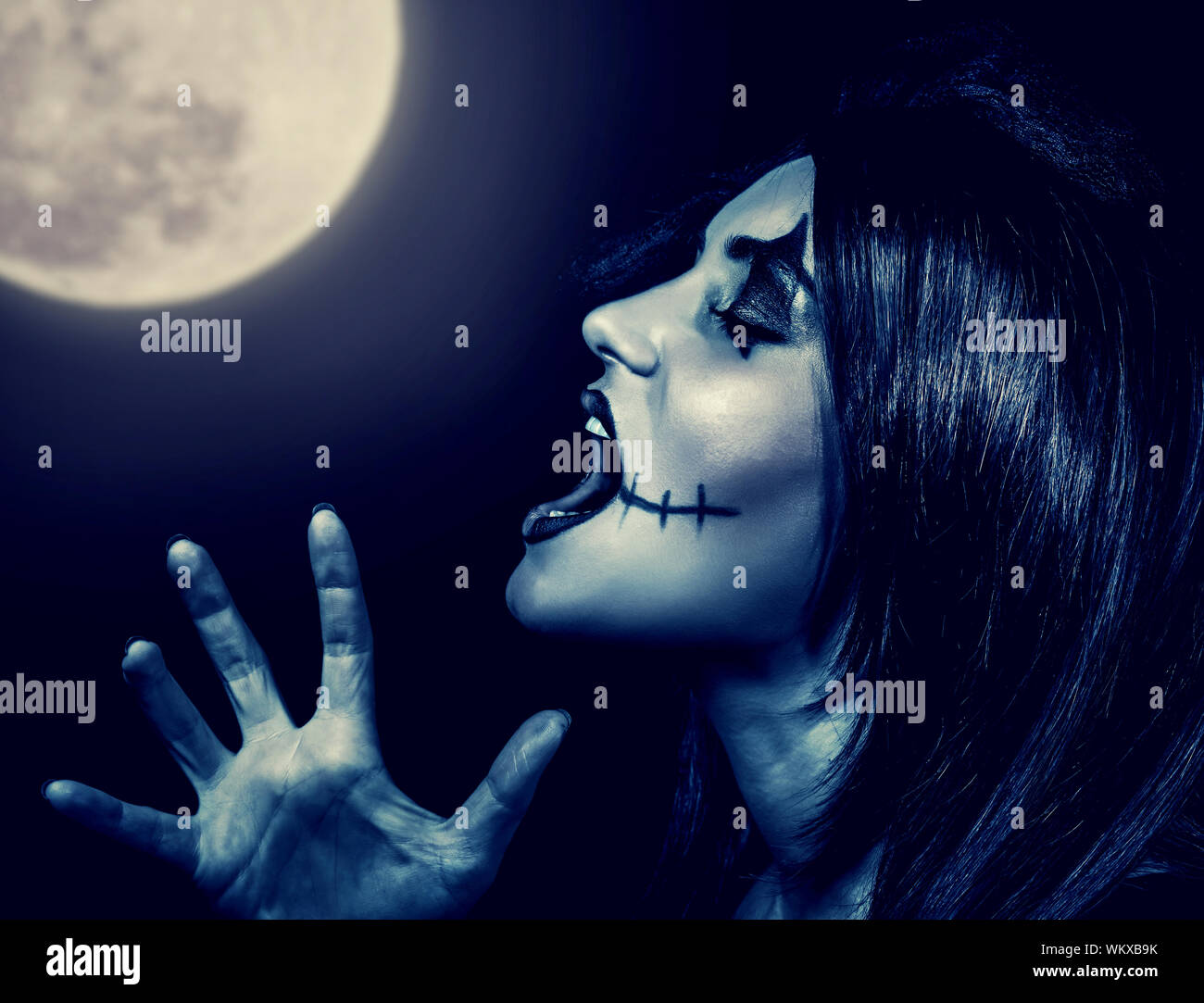Closeup portrait of terrifying witch yelling in full moon, aggressive ...