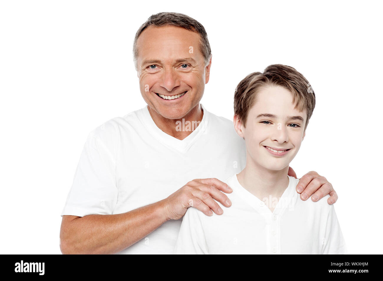 Happy father and son standing next to each other Stock Photo - Alamy