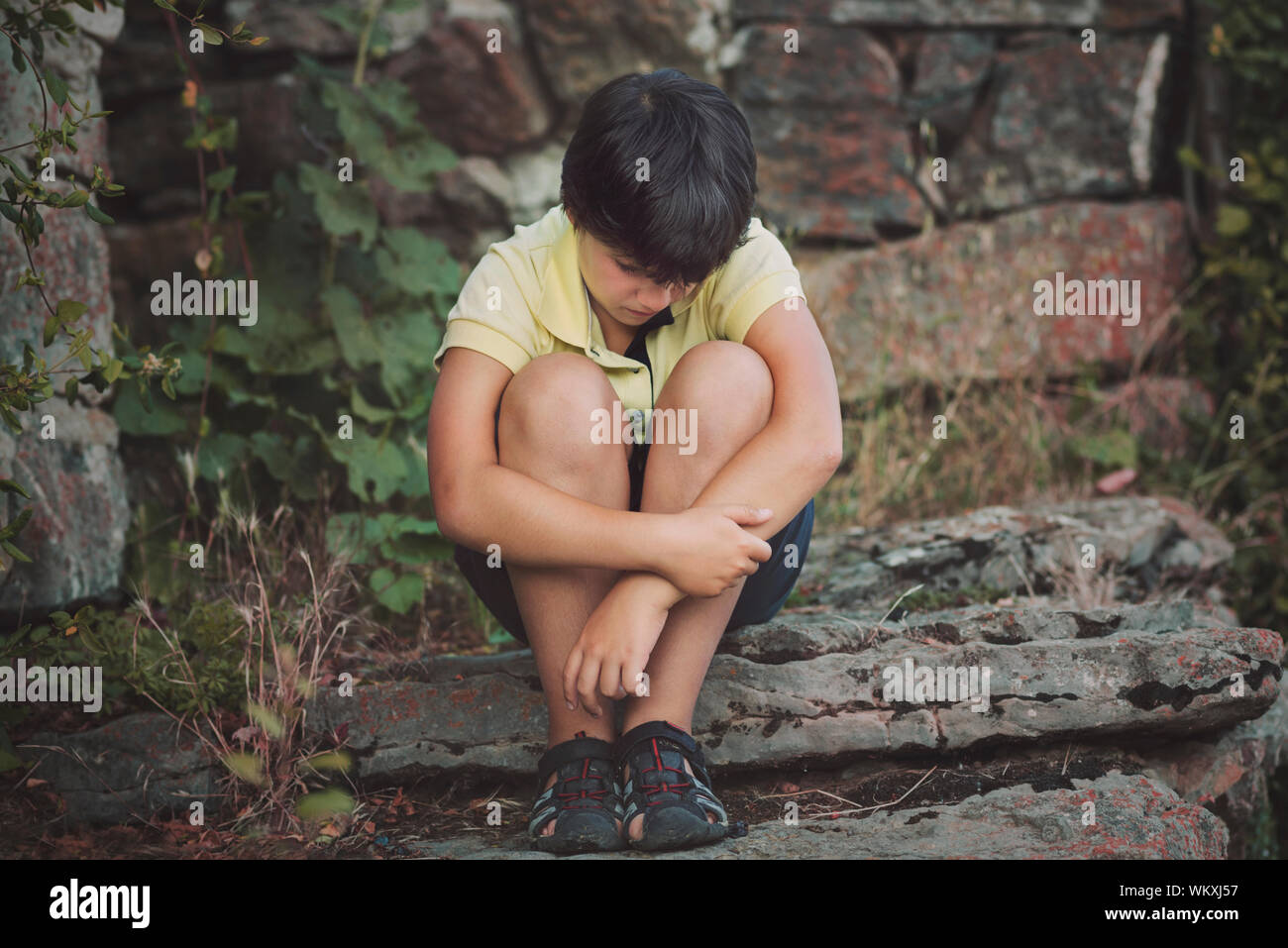 Portrait of sad little boy outdoor Stock Photo - Alamy