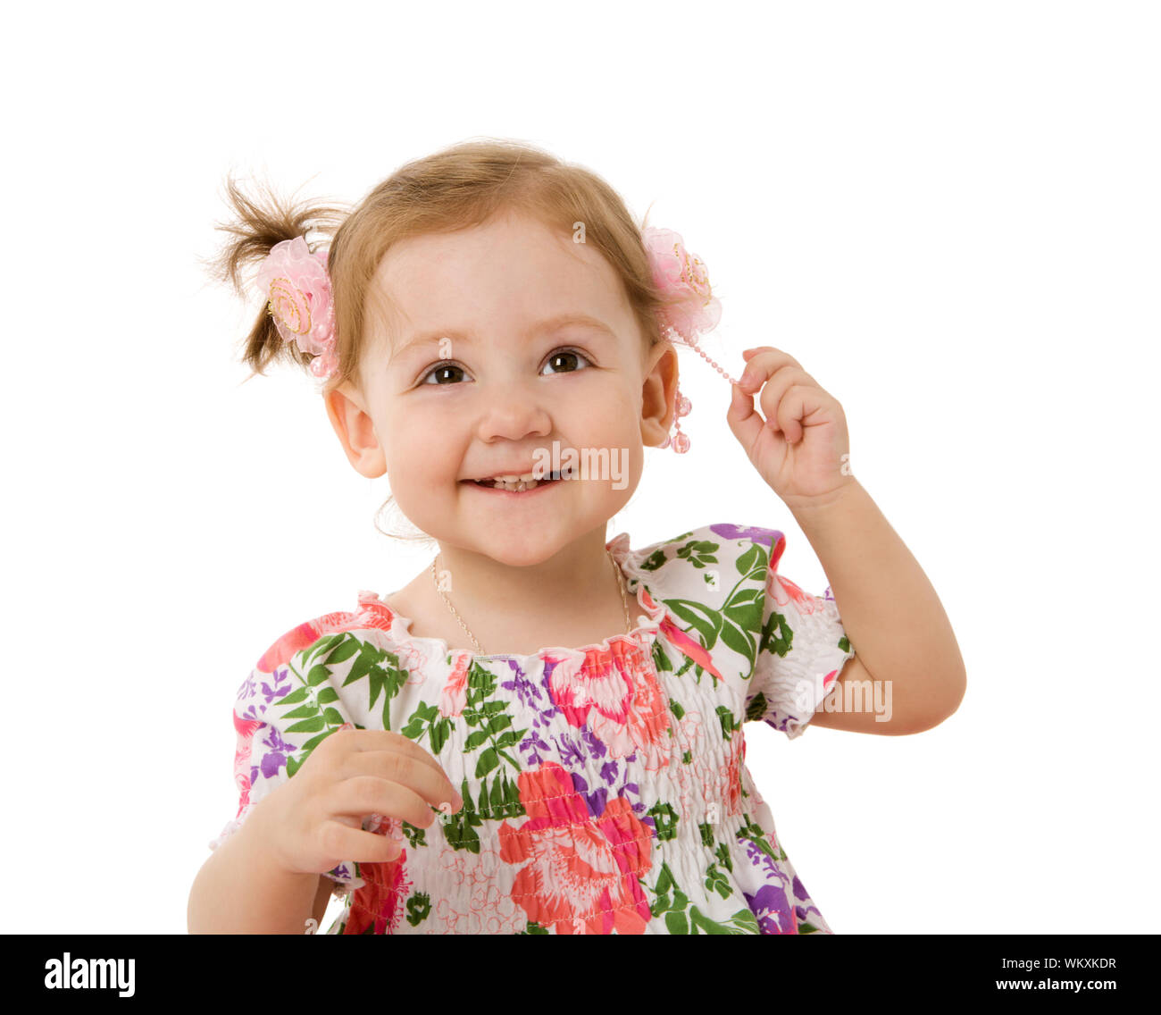 Happy little girl smiling looking up isolated Stock Photo - Alamy