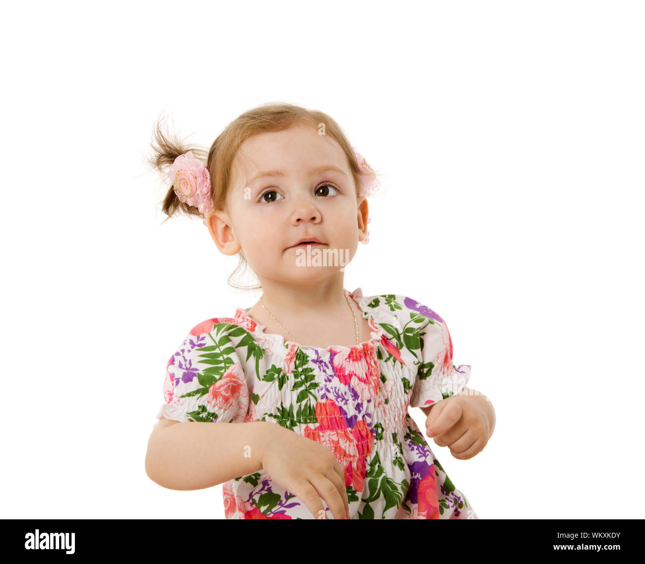 Happy little girl smiling looking up isolated Stock Photo - Alamy