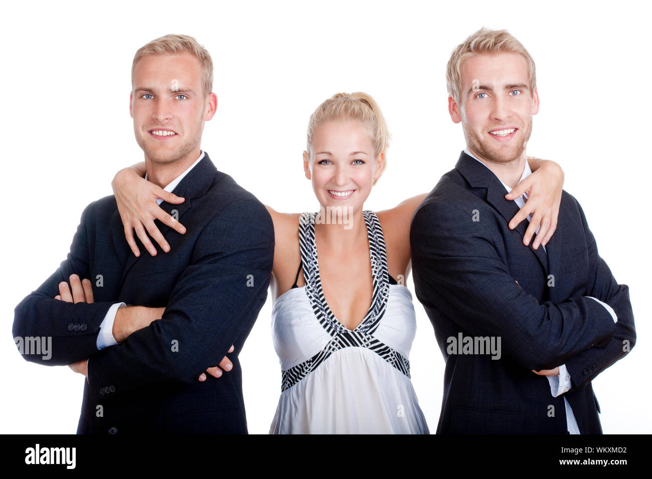 young woman in dress standing between two men in suits - isolated on ...