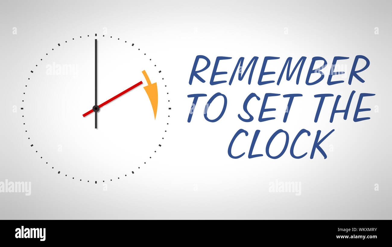 A clock at the wall with text remember to set the clock Stock Photo - Alamy