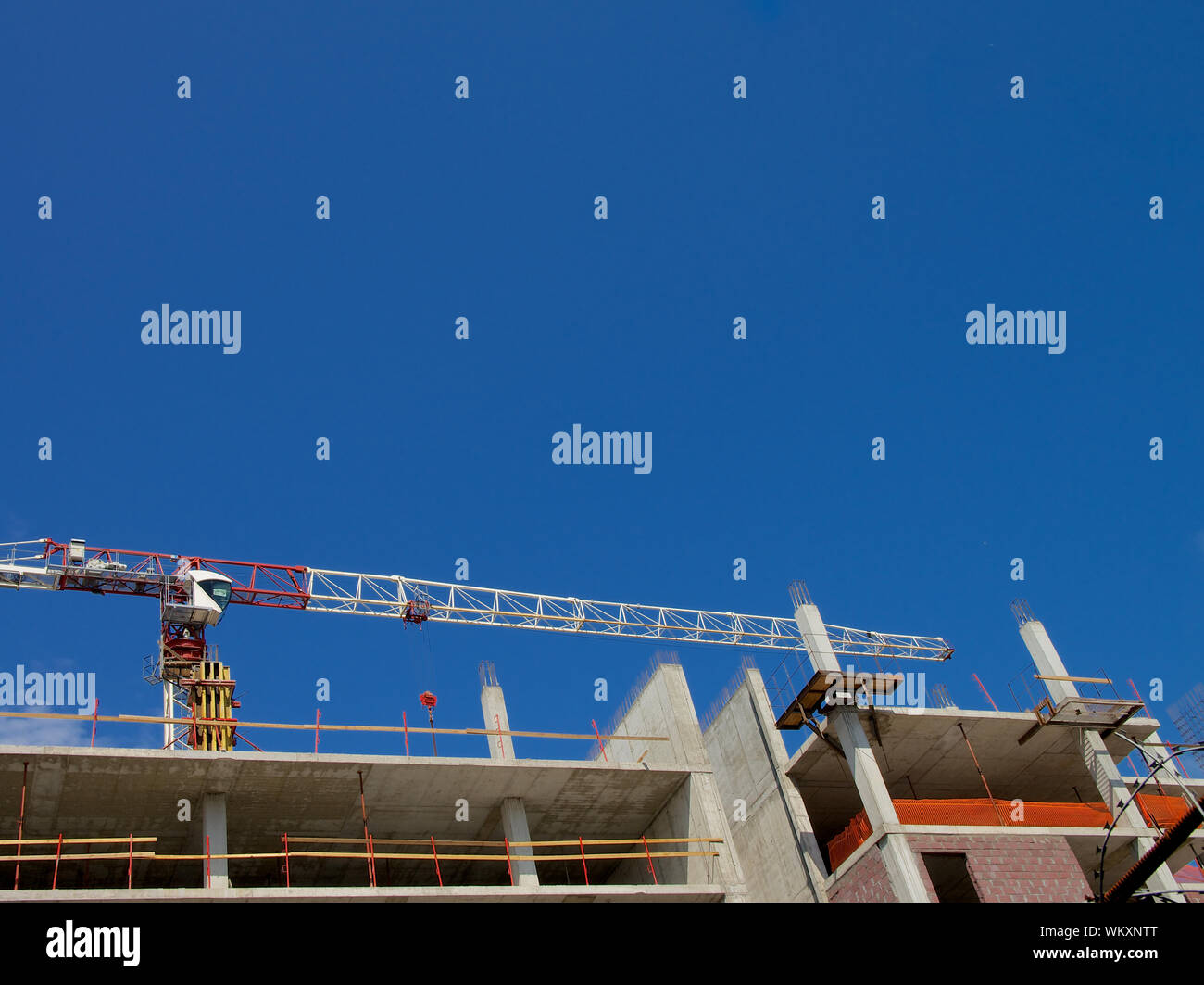 Building Block with Construction Crane Towering, Metal Scaffolding and ...