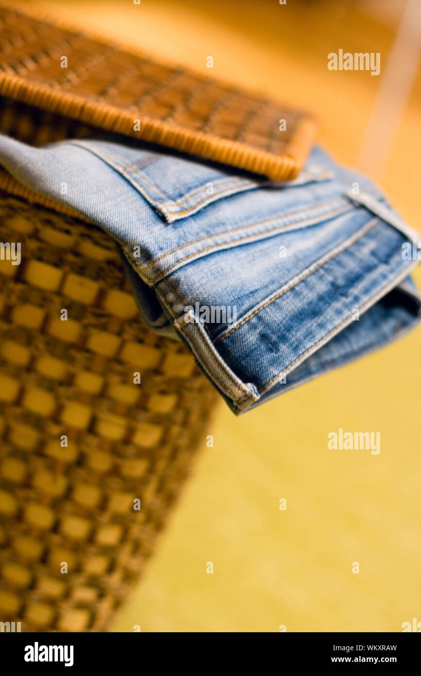 Blue jeans in a basket Stock Photo - Alamy