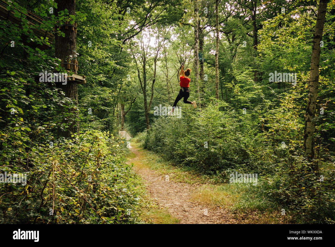 Person zip lining hi-res stock photography and images - Alamy