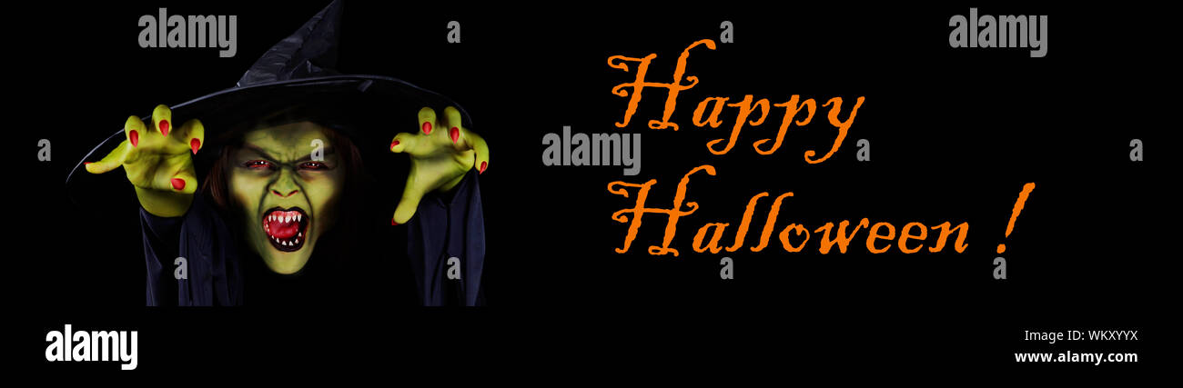 Scary wicked witch trying to catch viewer, Halloween banner Stock Photo ...