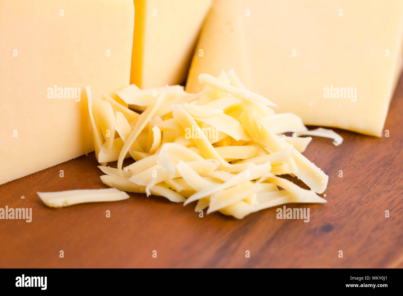 Block of cheddar cheese sliced hi-res stock photography and images - Alamy