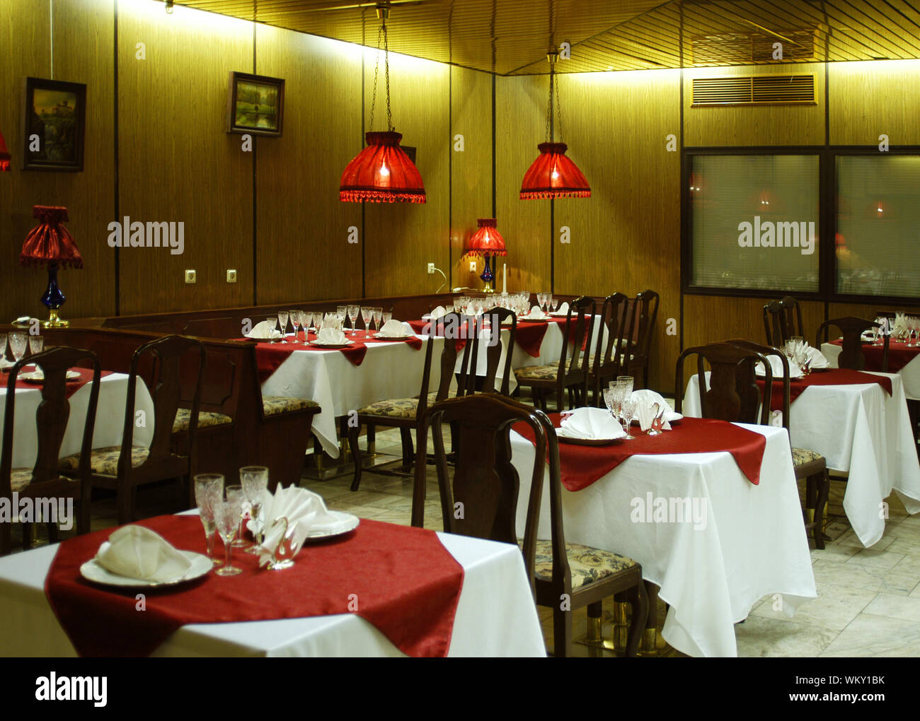 The cozy interior of the restaurant with red lights Stock Photo - Alamy