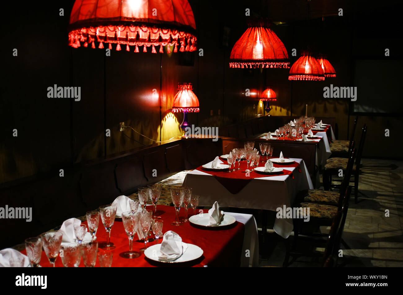 The cozy interior of the restaurant with red lights Stock Photo - Alamy