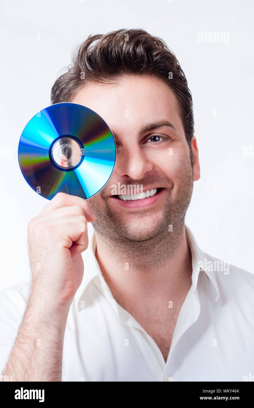 man in shirt standing smiling holding CD - isolated on white Stock ...