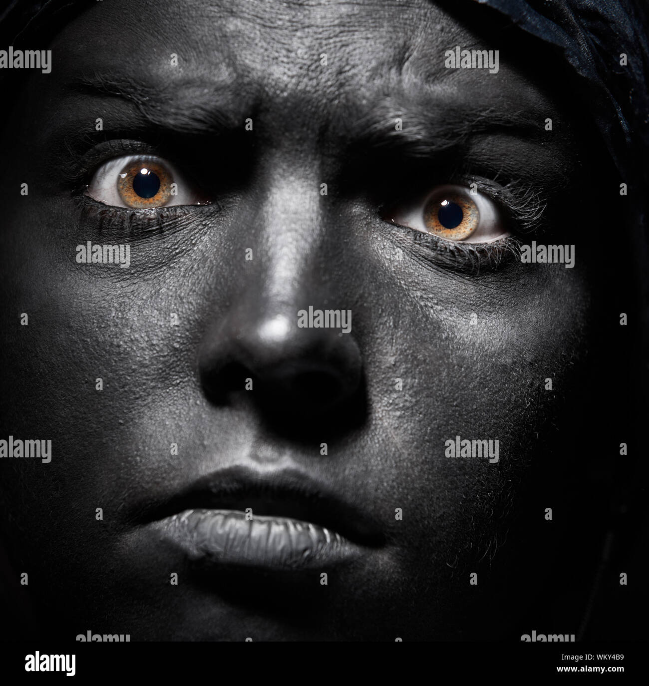 Astonished woman with black skin Stock Photo - Alamy