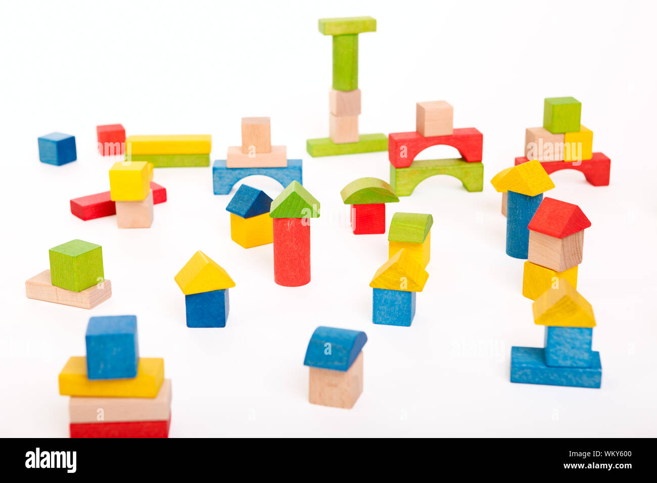 Colorful town build from wooden blocks isolated on white background ...