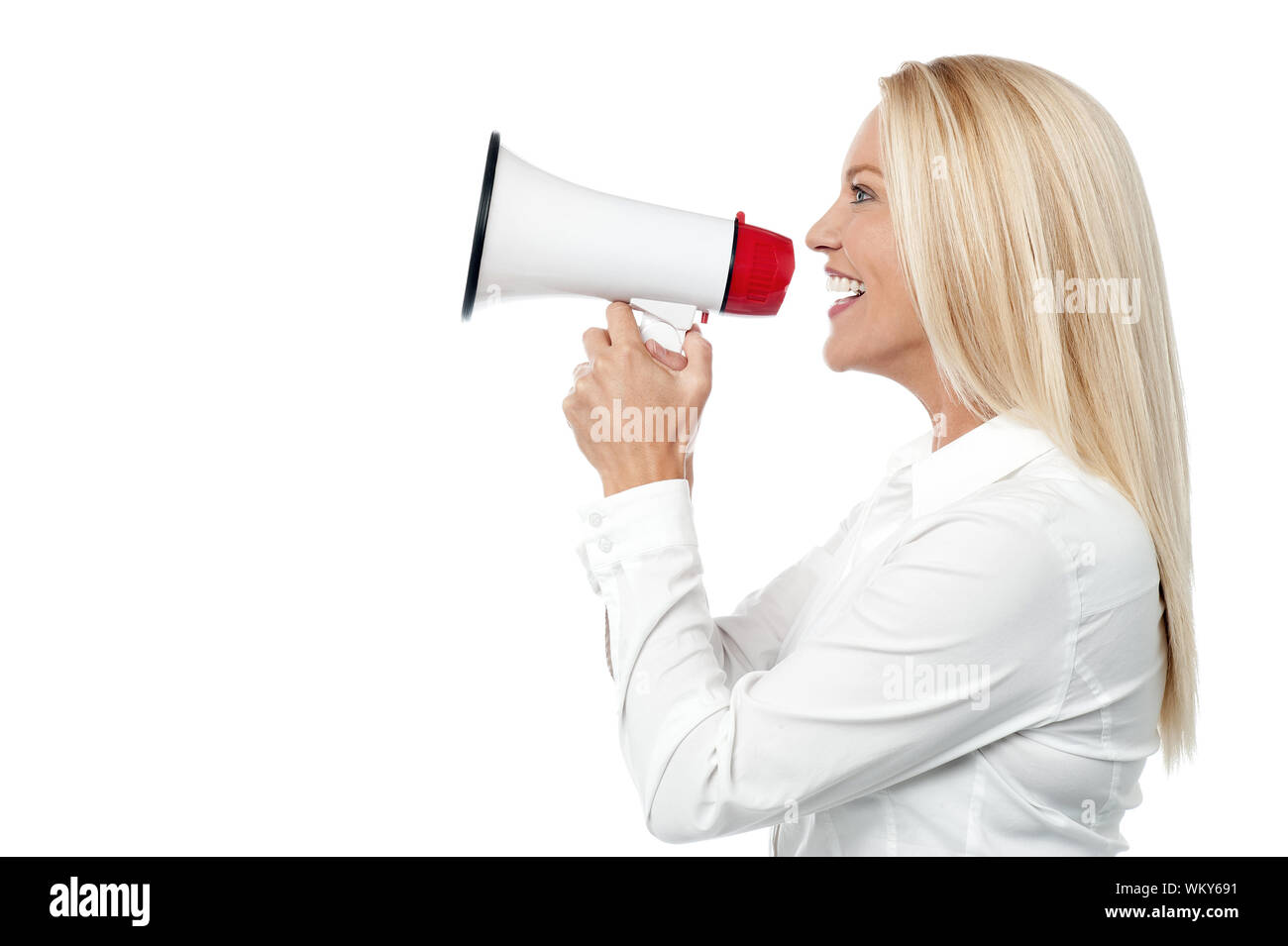 Woman speaking over a megaphone making a public announcement Stock ...