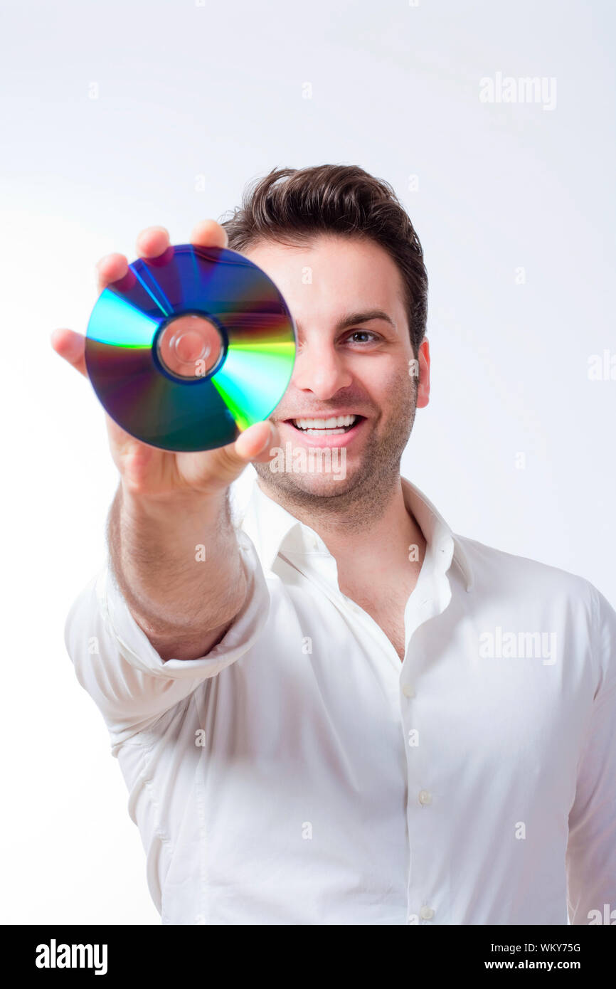 man in shirt standing smiling holding CD - isolated on white Stock ...