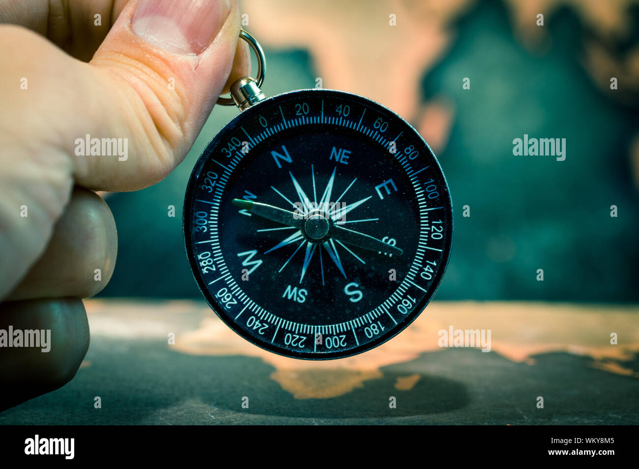 Holding map compass hi-res stock photography and images - Alamy