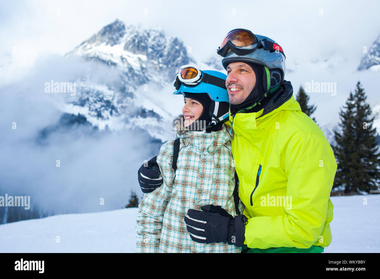 Ski, winter, snow, skiers, sun and fun - Family - father and daughter enjoying winter vacations ...