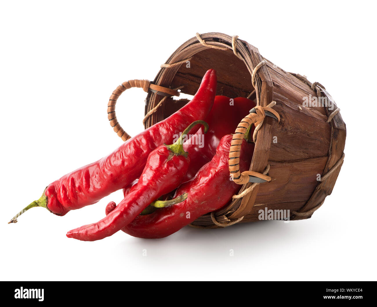 Red pepper in basket isolated on a white background Stock Photo - Alamy