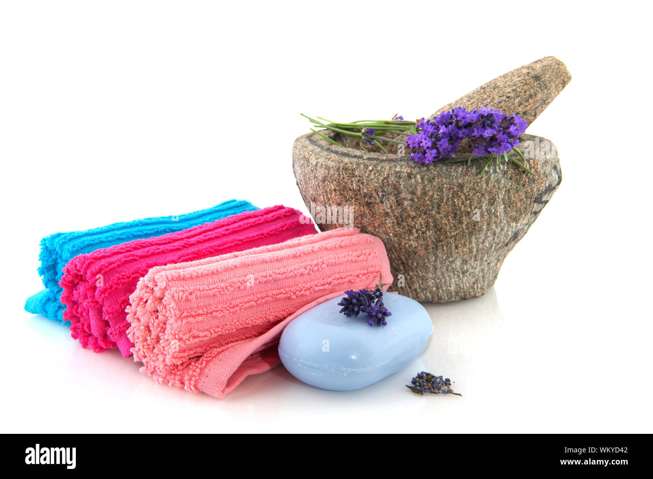 Rolled colorful towels with Lavender soap and mortar Stock Photo - Alamy