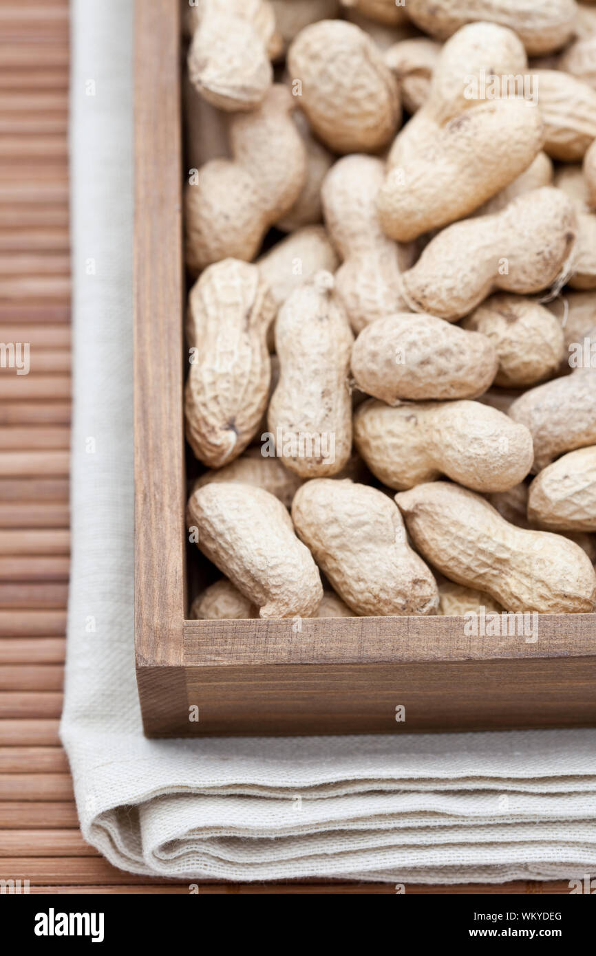 Peanuts known as also as monkey nuts in their shell in a box Stock ...