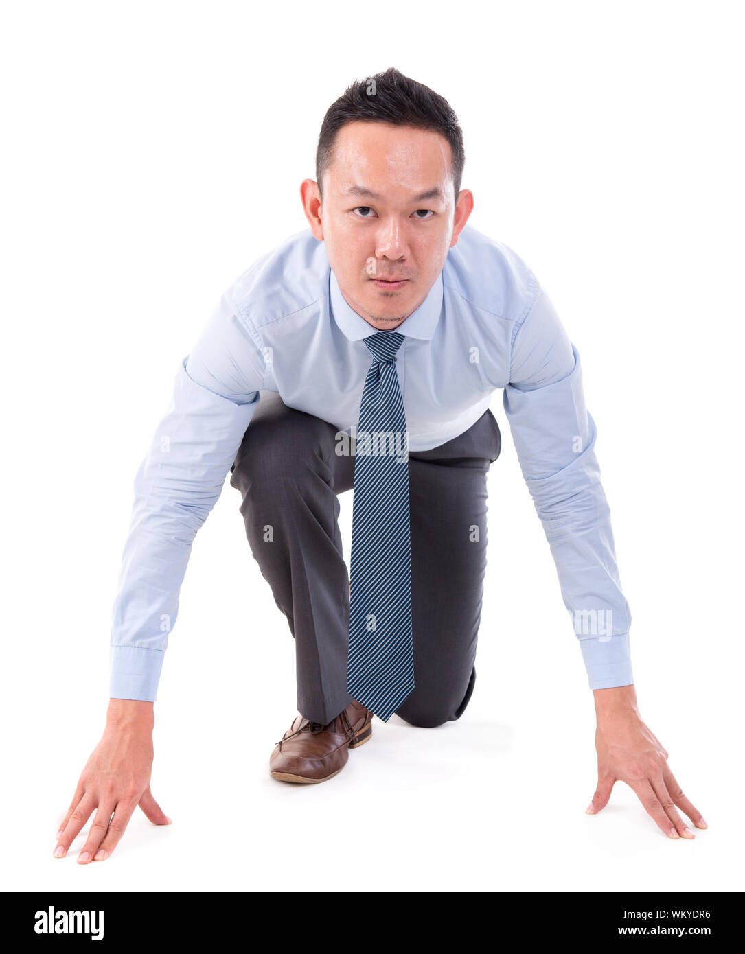 Asian business male on starting line of a race, front view full length ...