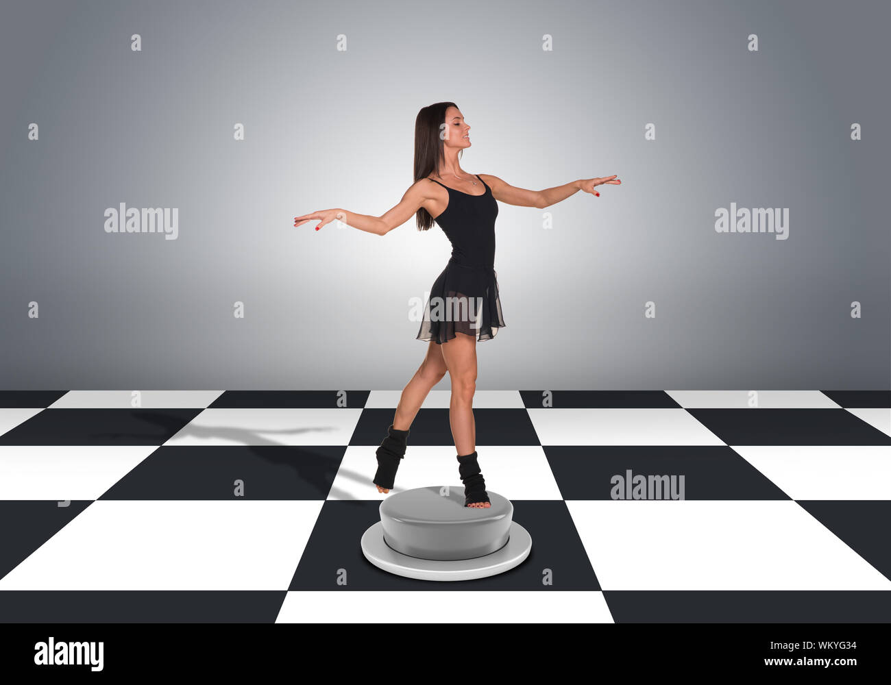 Beautiful dancer dancing. Floor with checkerboard texture and gray wall ...