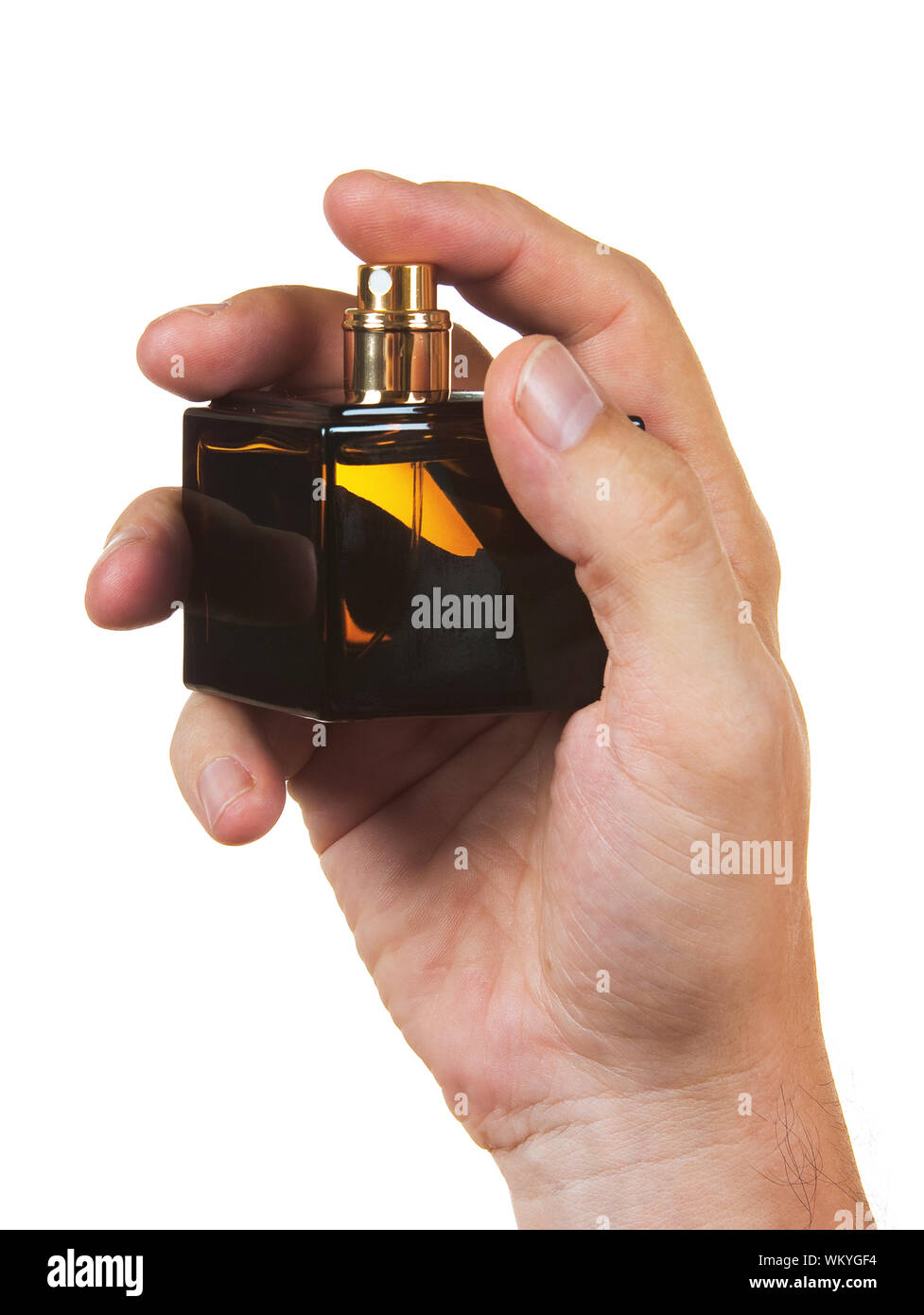 bottle of cologne in his hand isolated on a white background Stock ...