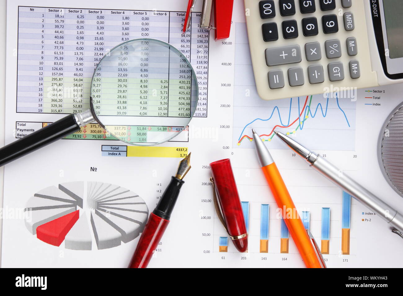 Graphs tables and documents laid on the table Stock Photo - Alamy