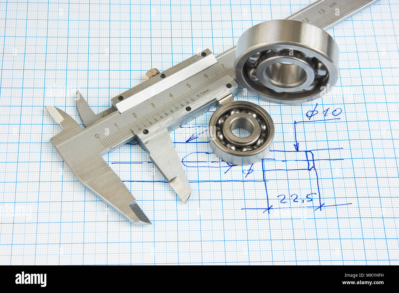 calipers, bearing and square on the background of graph paper Stock ...